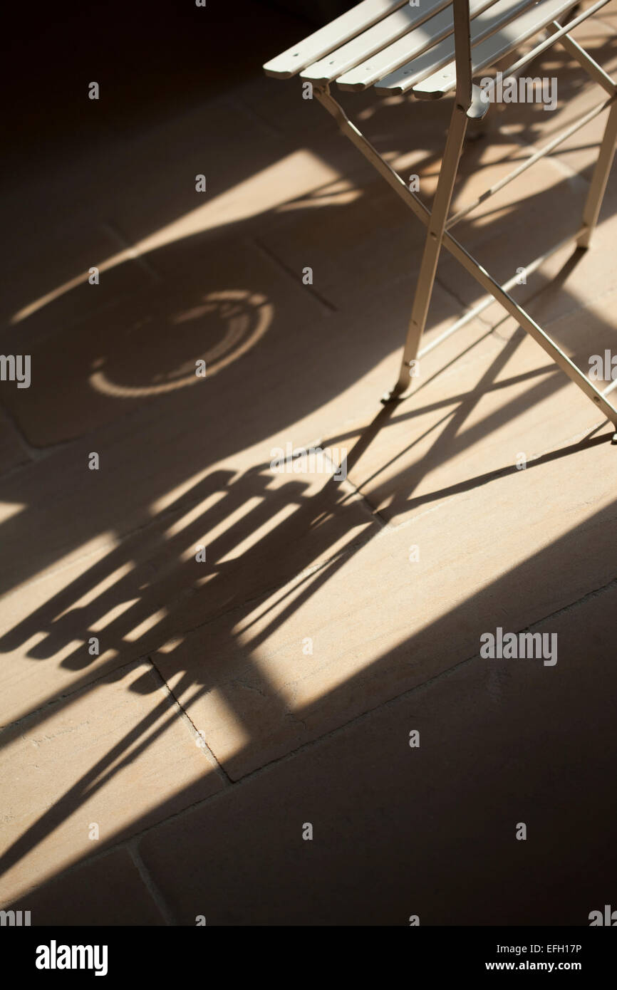 Shadows and chairs on a terrace Stock Photo - Alamy
