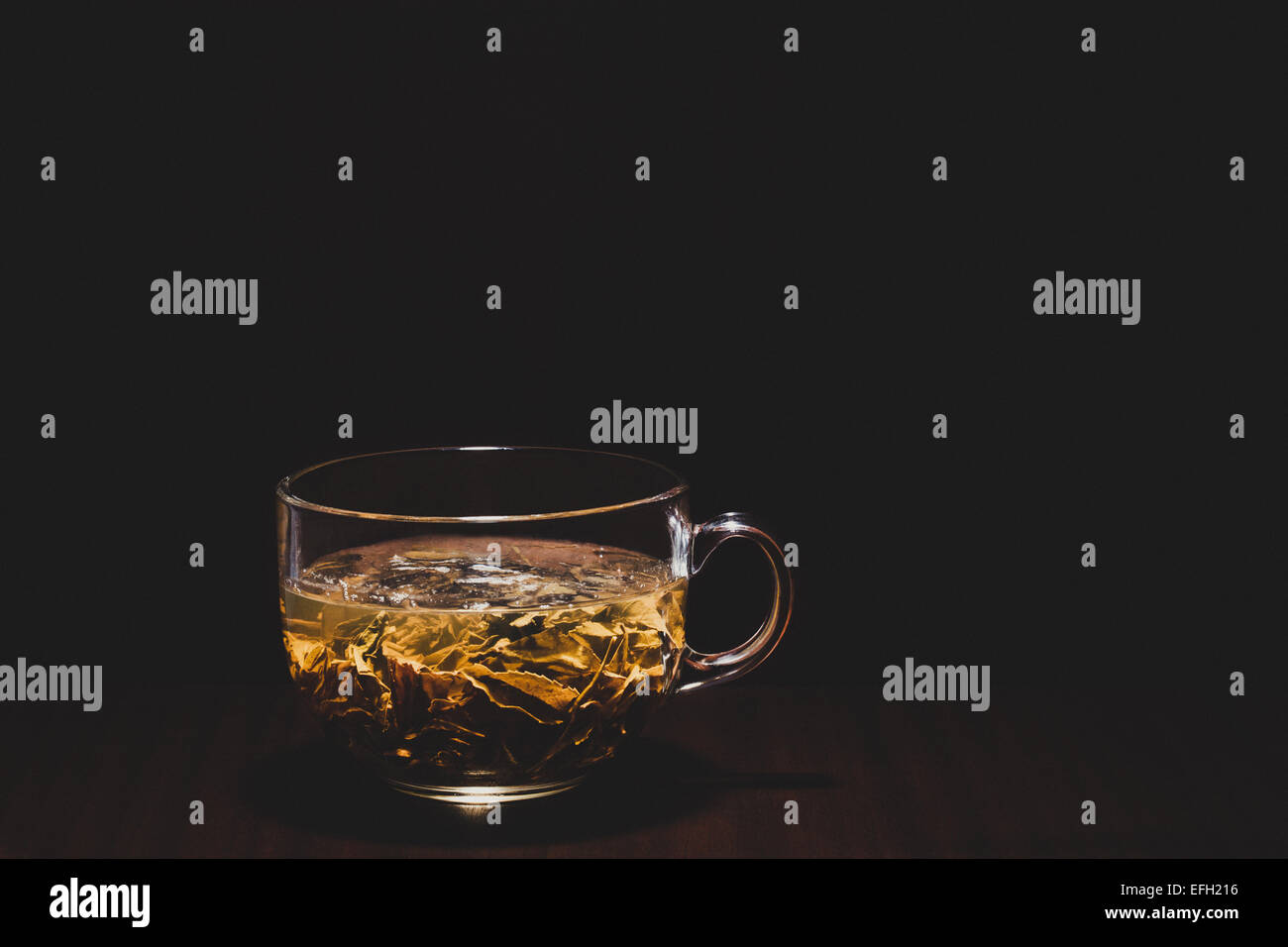 Green tea on a dark background Stock Photo - Alamy