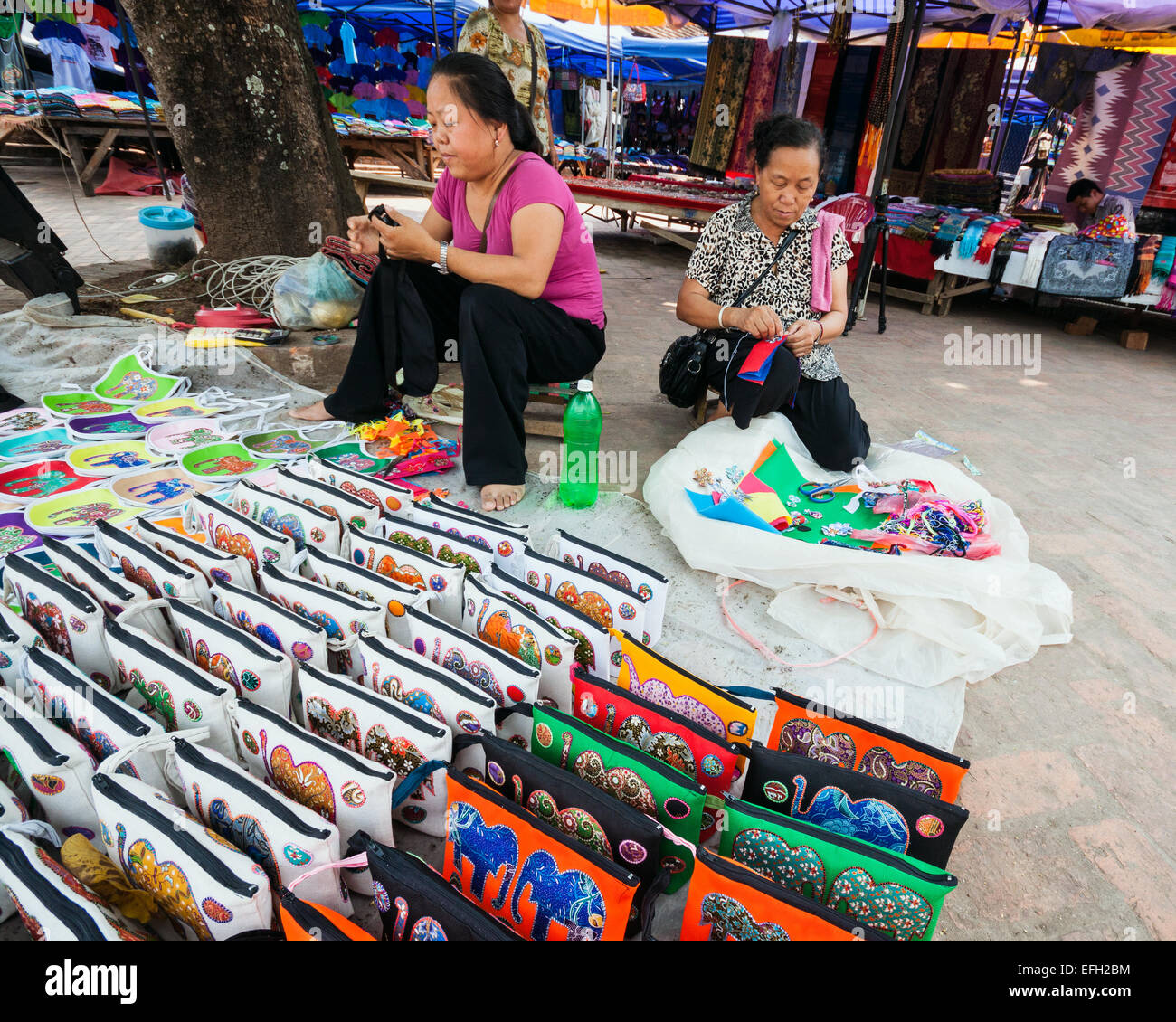 Two Lao women selling beautiful handcrafted purse in Luang Prabang ...