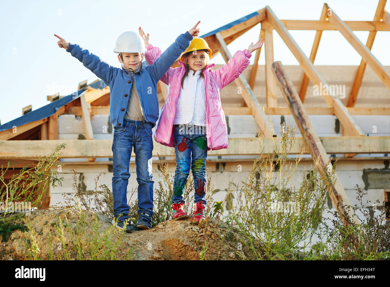 boy and girl playing on construction site Stock Photo - Alamy