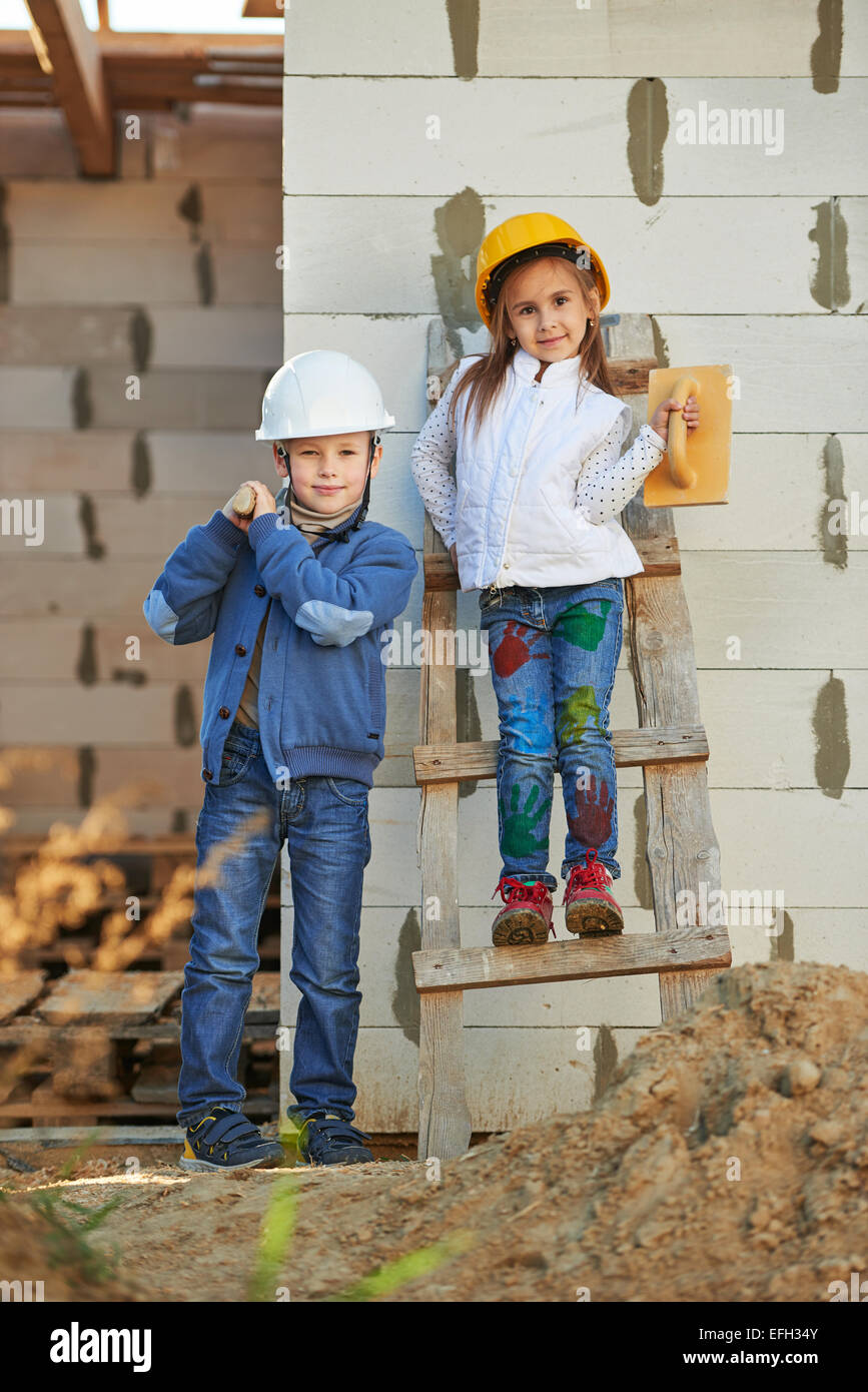 boy and girl playing on construction site Stock Photo - Alamy