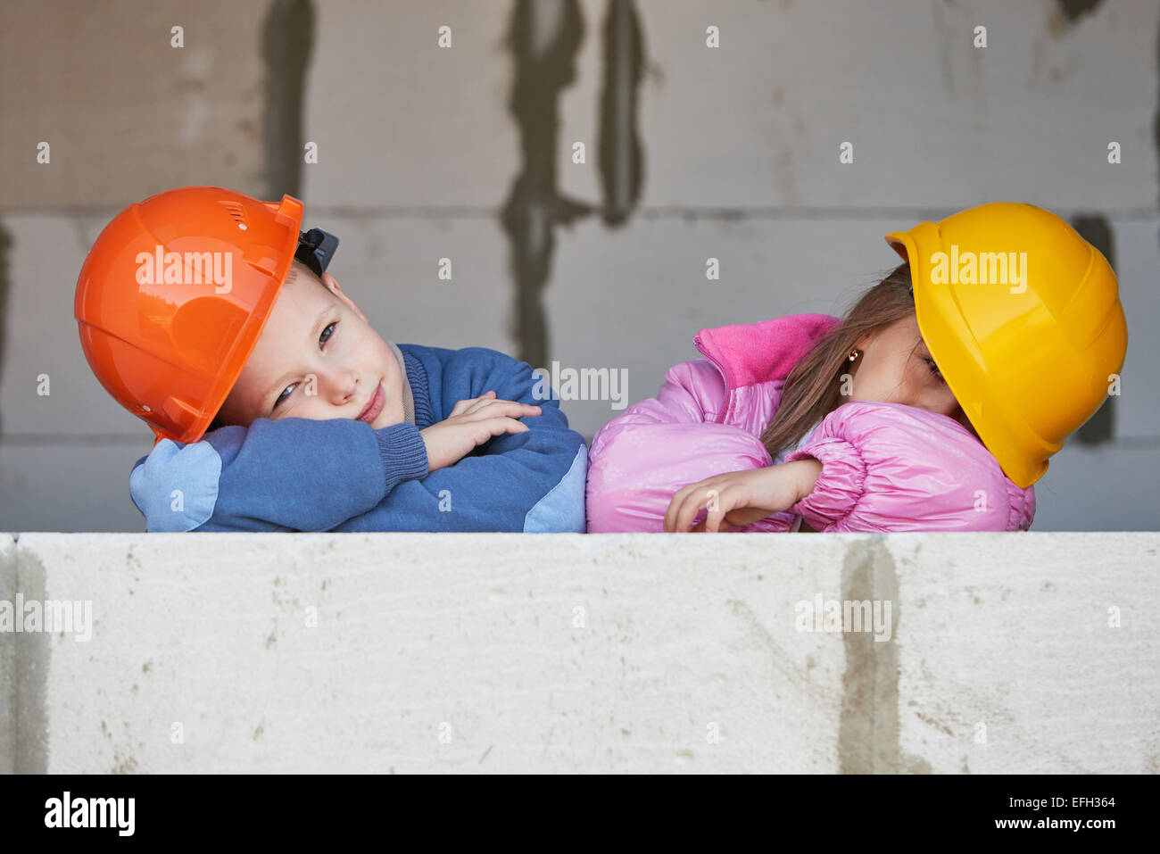 boy and girl playing on construction site Stock Photo - Alamy