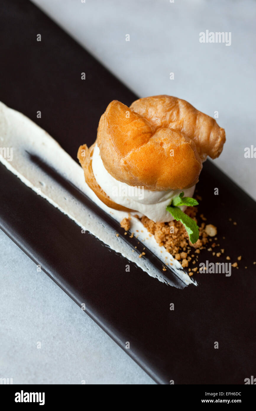 Cream puff cake on a plate Stock Photo - Alamy
