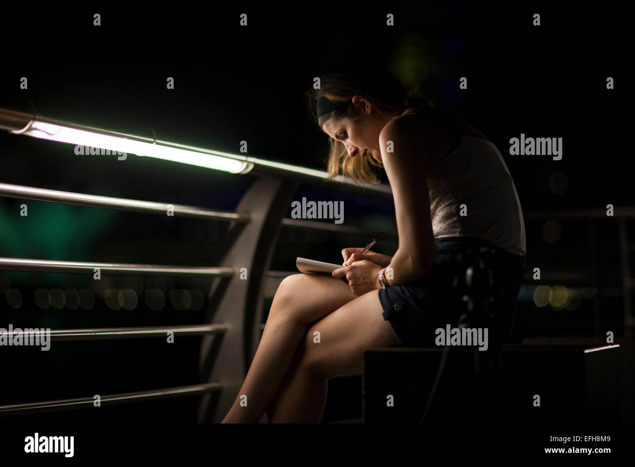 Woman writing hi-res stock photography and images - Alamy