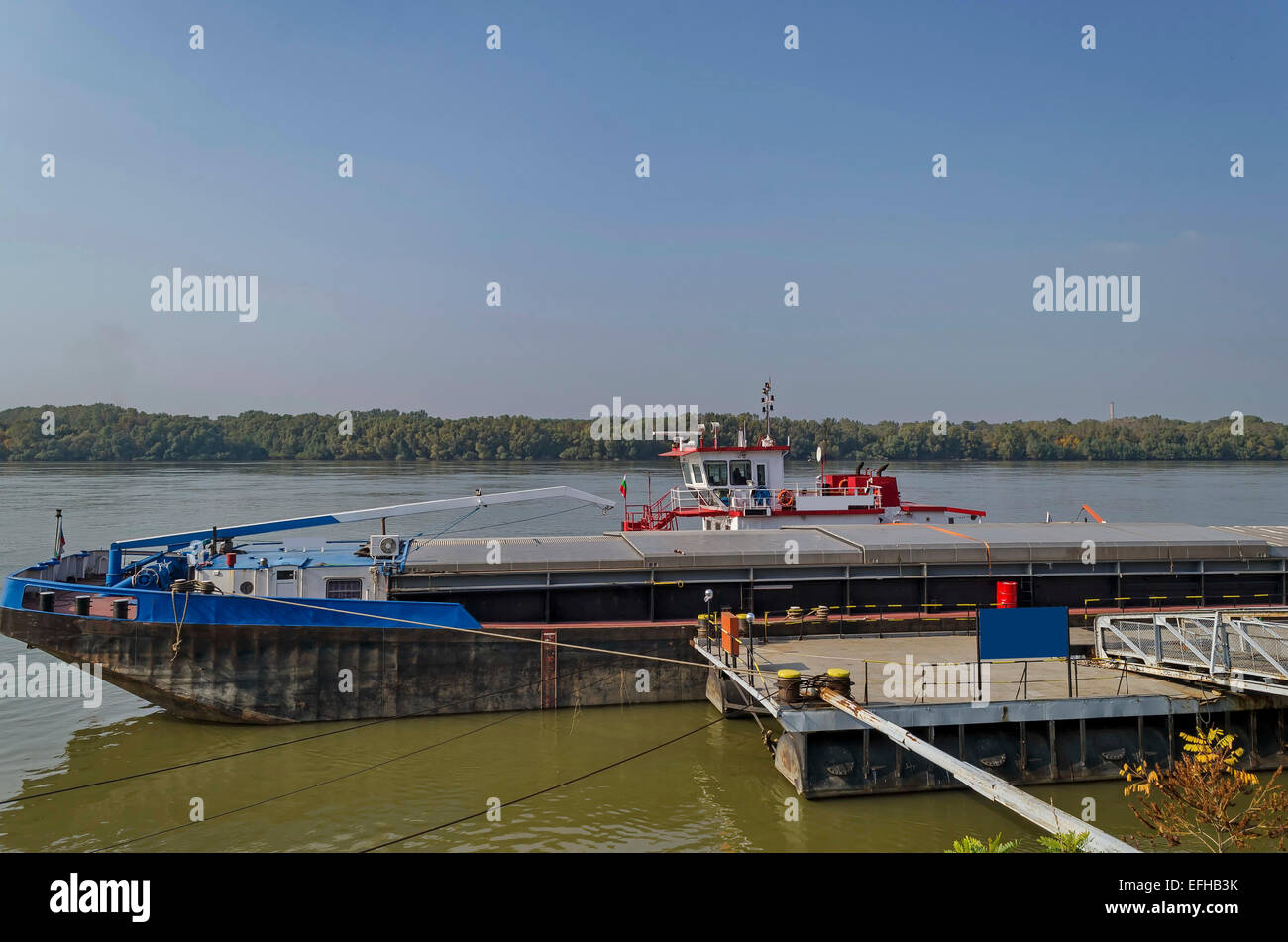 River cargo boat at pontoon in Ruse Danube port, Bulgaria Stock Photo ...
