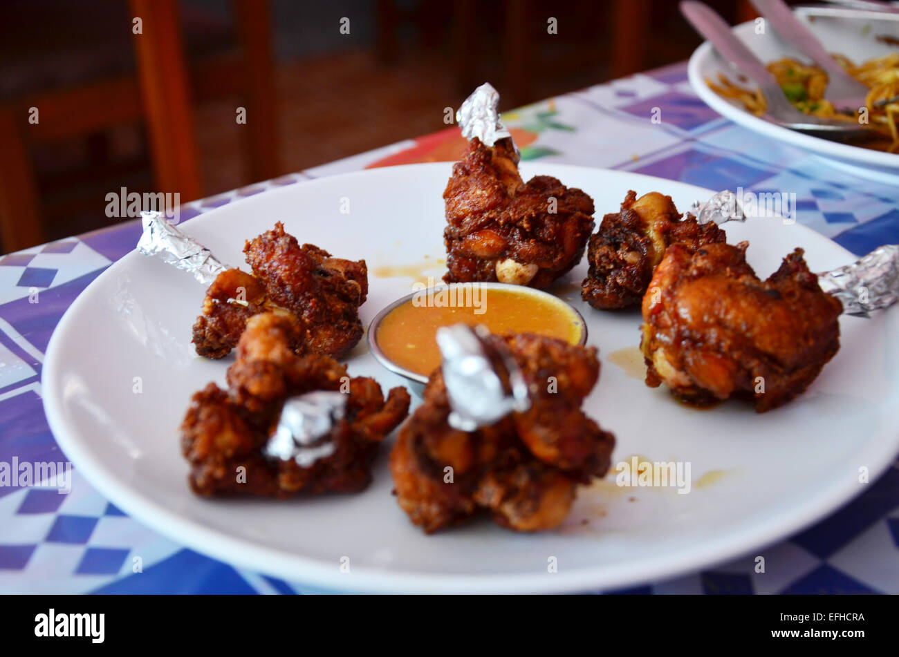 Nepal cuisine Fried Chicken curry mix Stock Photo - Alamy