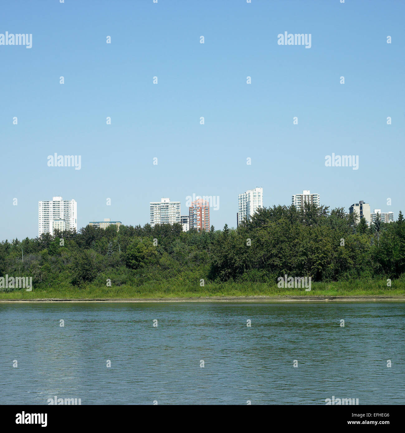 City towers near a river Stock Photo - Alamy