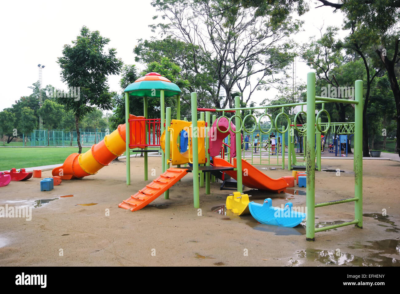Colorful children playground in the park Stock Photo - Alamy