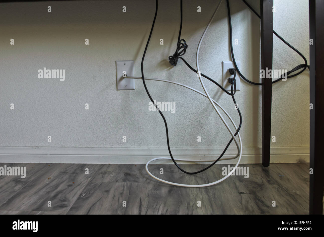 Untidy wired cable TV and dirty floor Stock Photo - Alamy