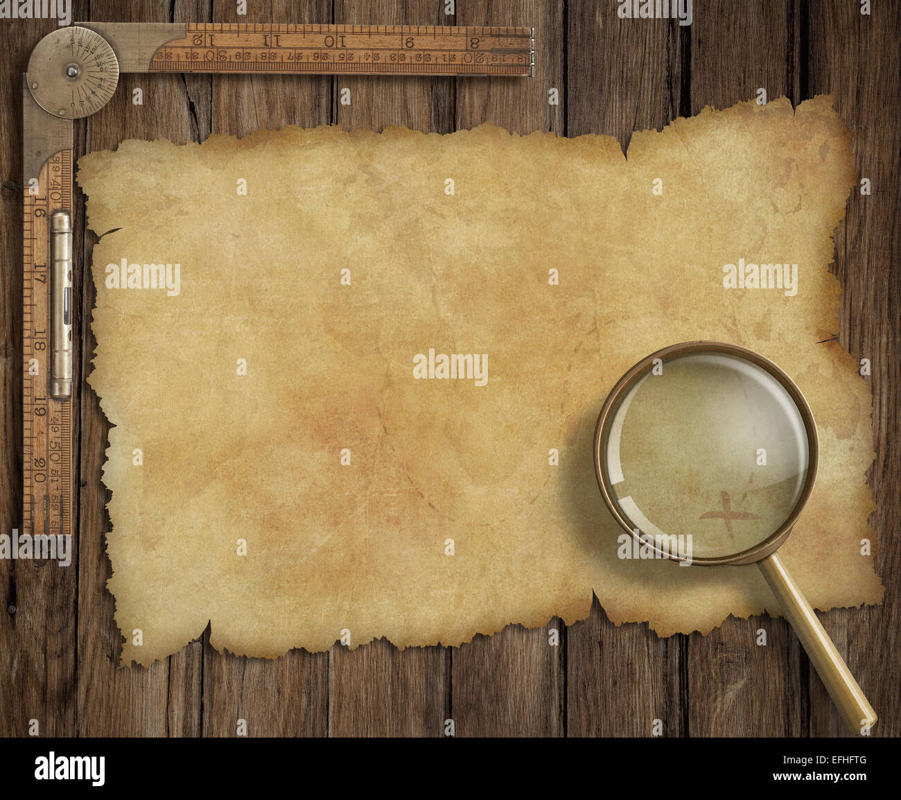 old treasure map on wooden desk with loupe and ruler Stock Photo - Alamy