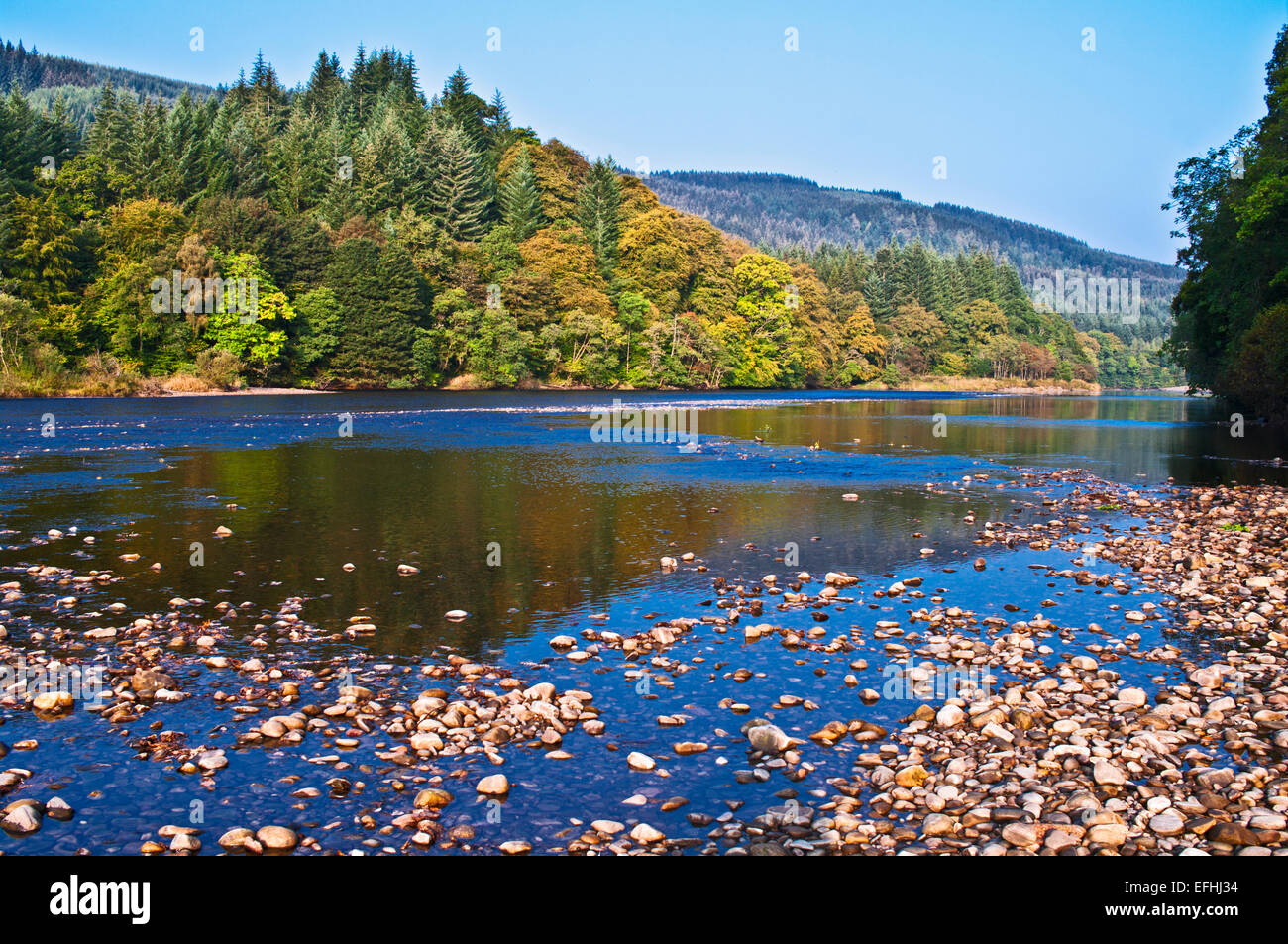 River Tay at Dunkeld, calm sunny autumn day, low water, stones exposed ...