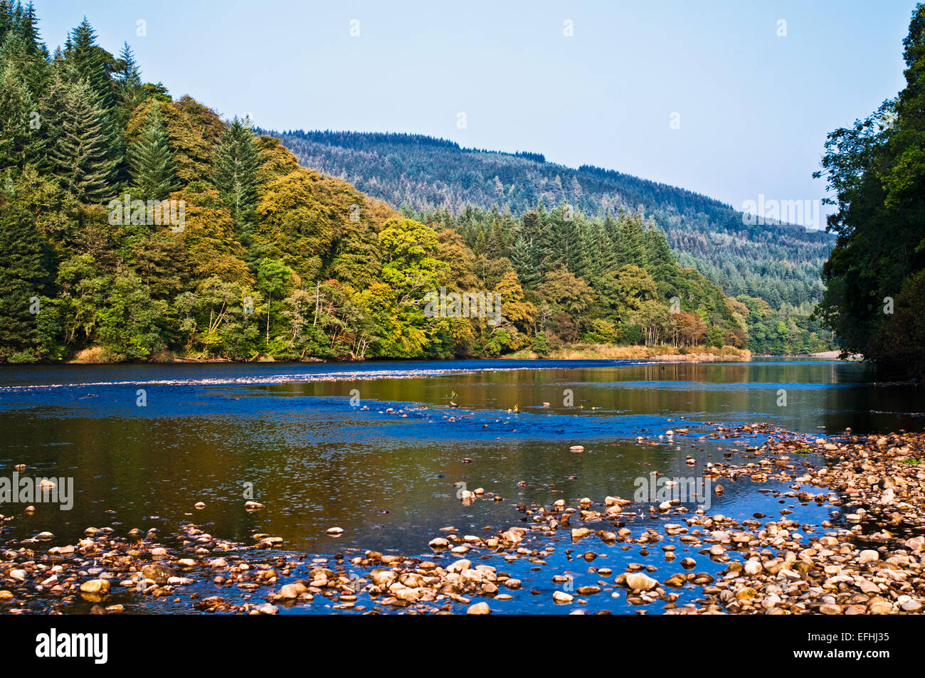 River Tay at Dunkeld, calm sunny autumn day, low water, stones exposed ...