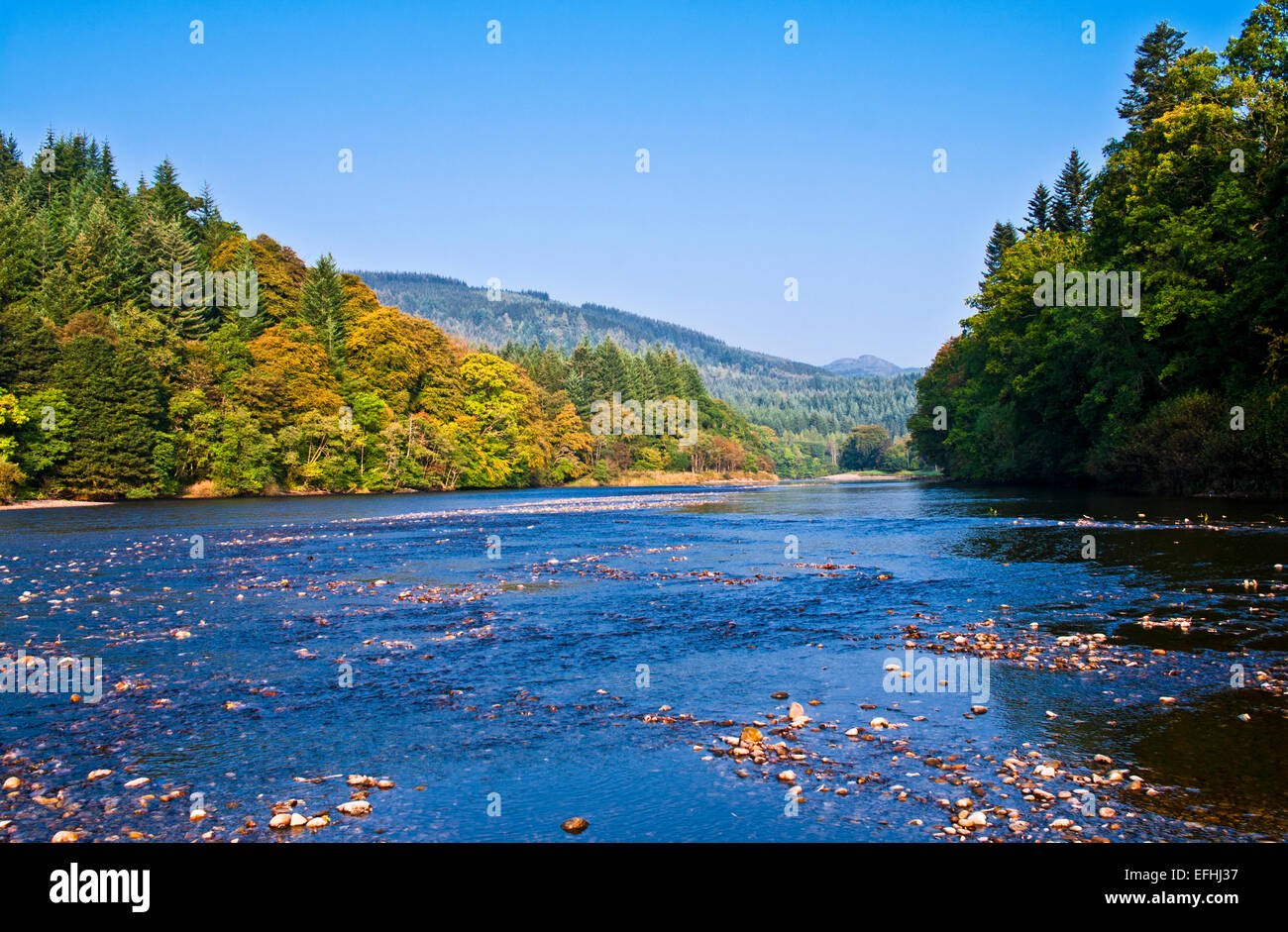 River Tay at Dunkeld, calm sunny autumn day, low water, stones exposed ...