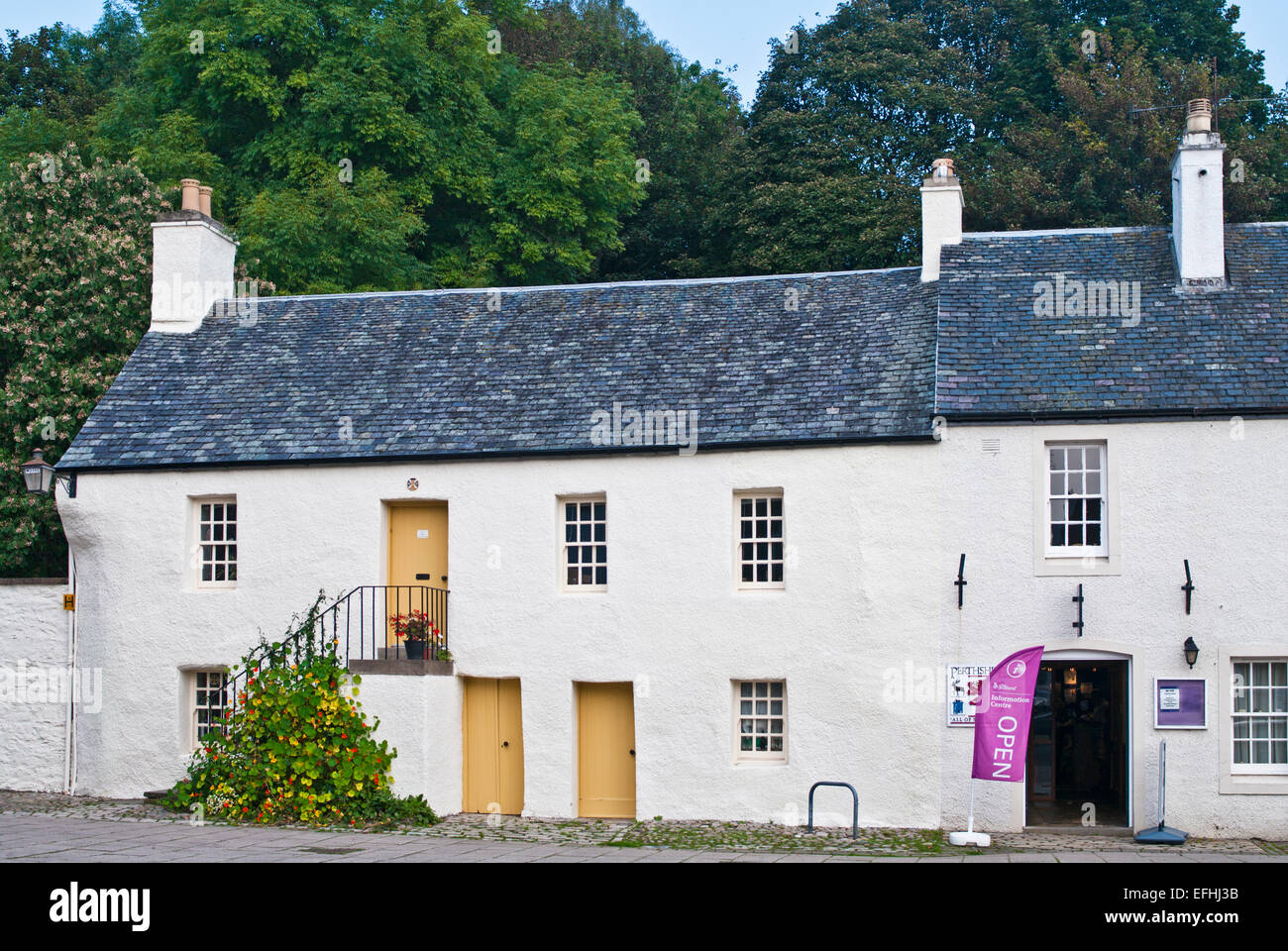 Old restored traditional white cottages adjoining the Tourist ...