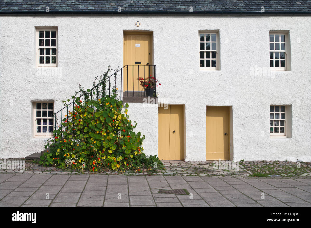 Old restored traditional white cottages, Dunkeld Town Square ...