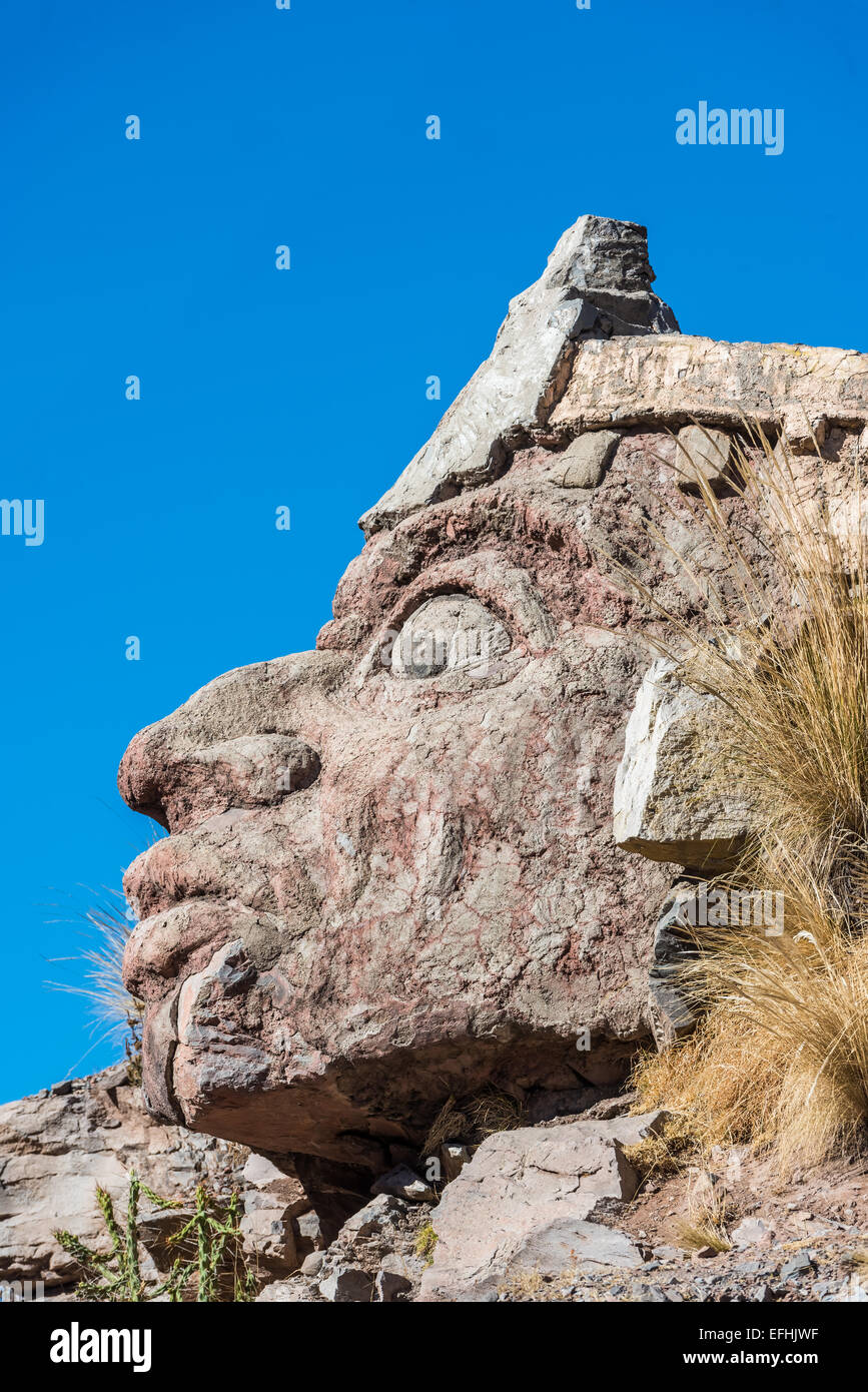 Inca face sculpture in the peruvian Andes at Puno Peru Stock Photo - Alamy