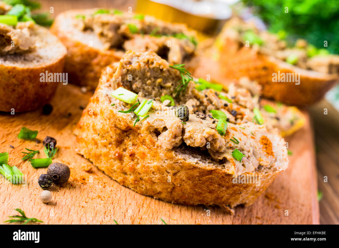 Tapas. Bread with meat paste, herbs and spices Stock Photo - Alamy