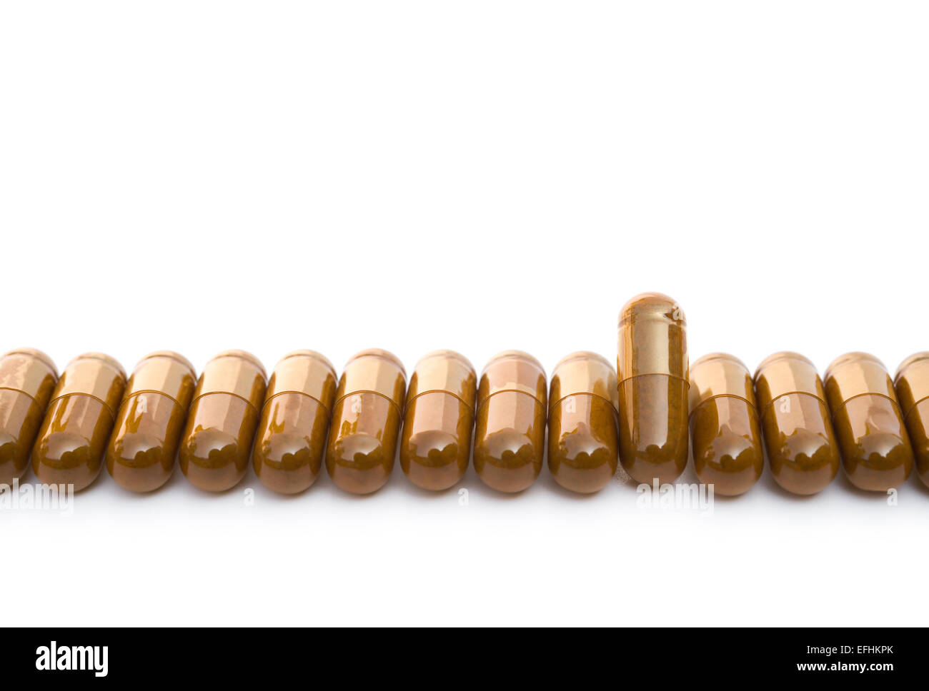 capsules line up on a white background Stock Photo - Alamy
