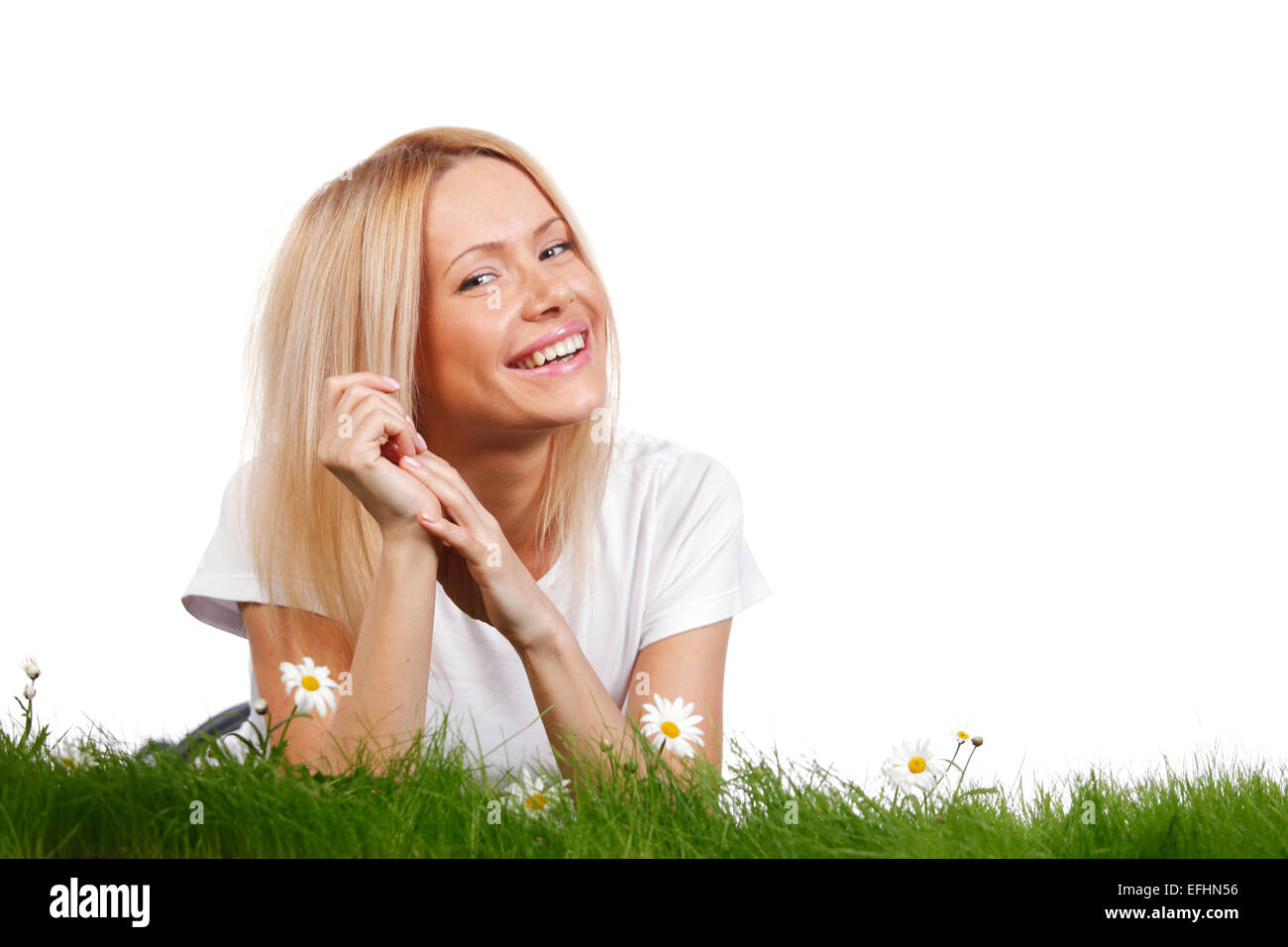 Beautiful Young Blonde Woman Lying On Grass With Chamomile Flowers