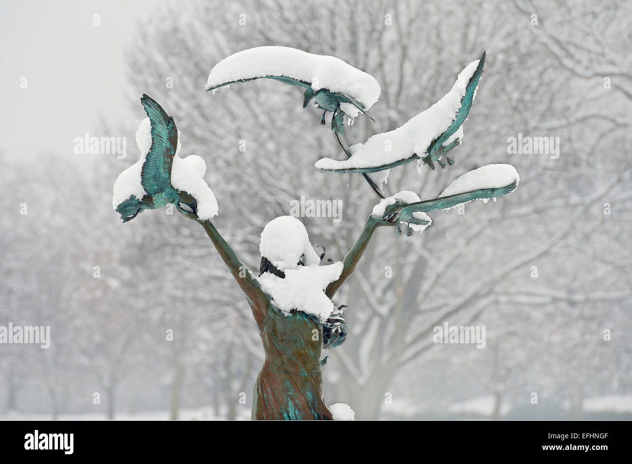 Statue with snow on top Stock Photo - Alamy