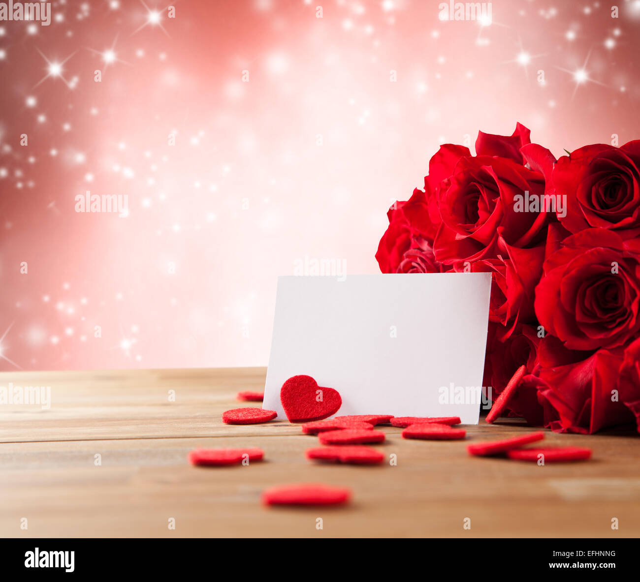Bouquet of roses on wooden desk Stock Photo - Alamy