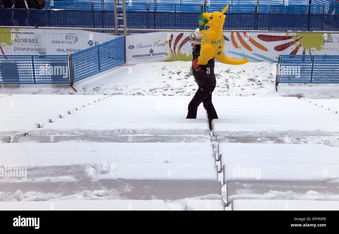 An Australian supporter with an inflatable kangaroo on her back leaves ...