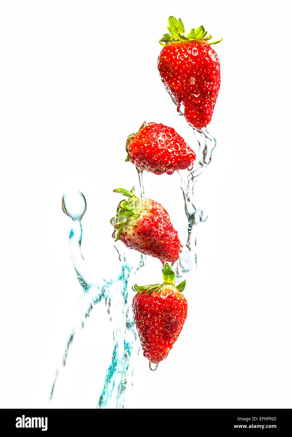 Strawberry splash on white background Stock Photo - Alamy