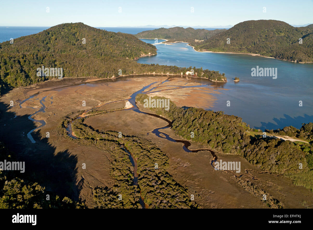 Aerial view of the Awaroa Inlet with meandering river, Abel Tasman ...