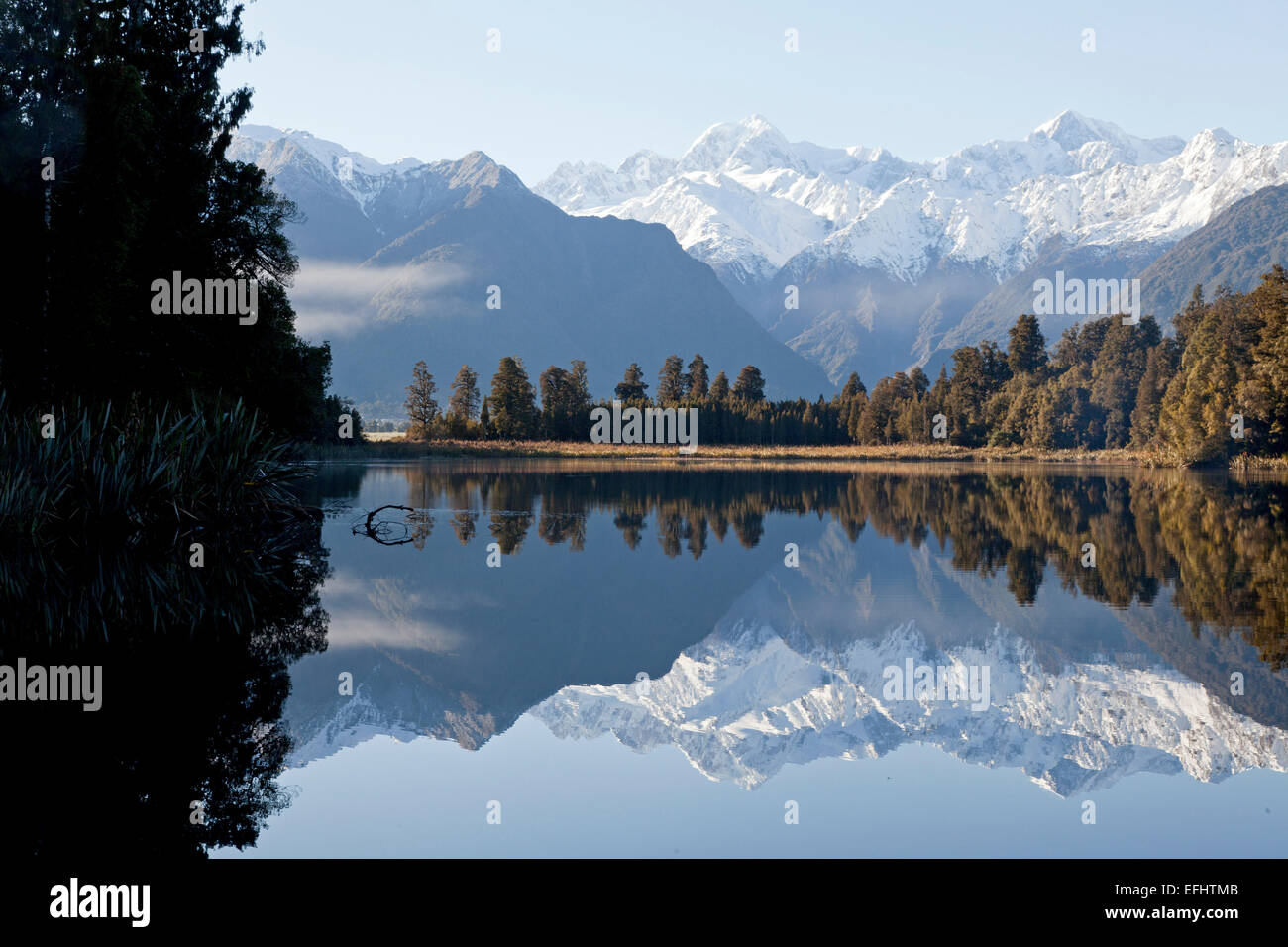 Perfect mountain reflection in Lake Matheson with Mount Tasman and ...