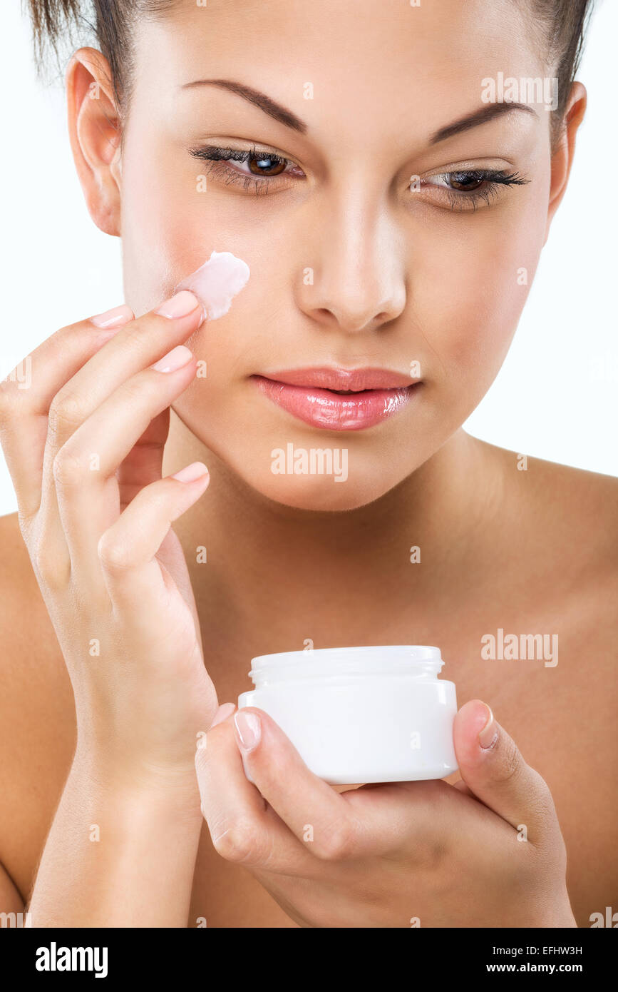 Flawless-skinned woman with moisturizing face cream Stock Photo - Alamy