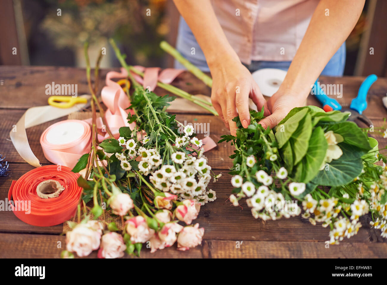 Female florist making floral bouquets in workshop Stock Photo - Alamy