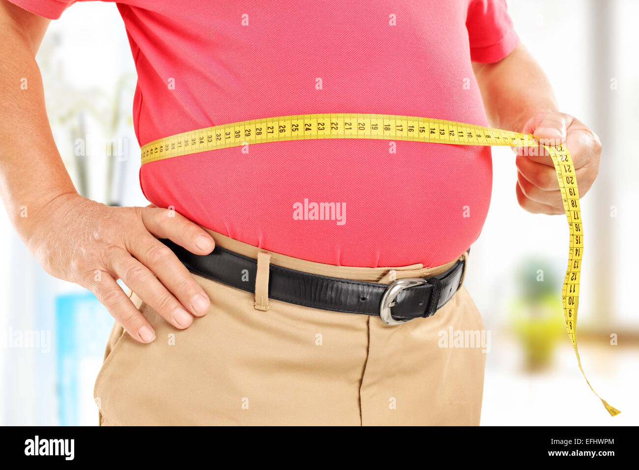 Fat stomach tape measure hi-res stock photography and images - Alamy