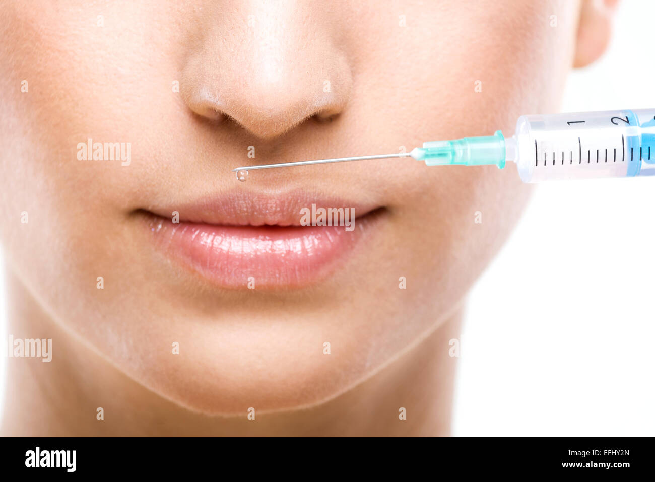 Beautiful female lips plastic surgery, her lips at the needle Stock ...