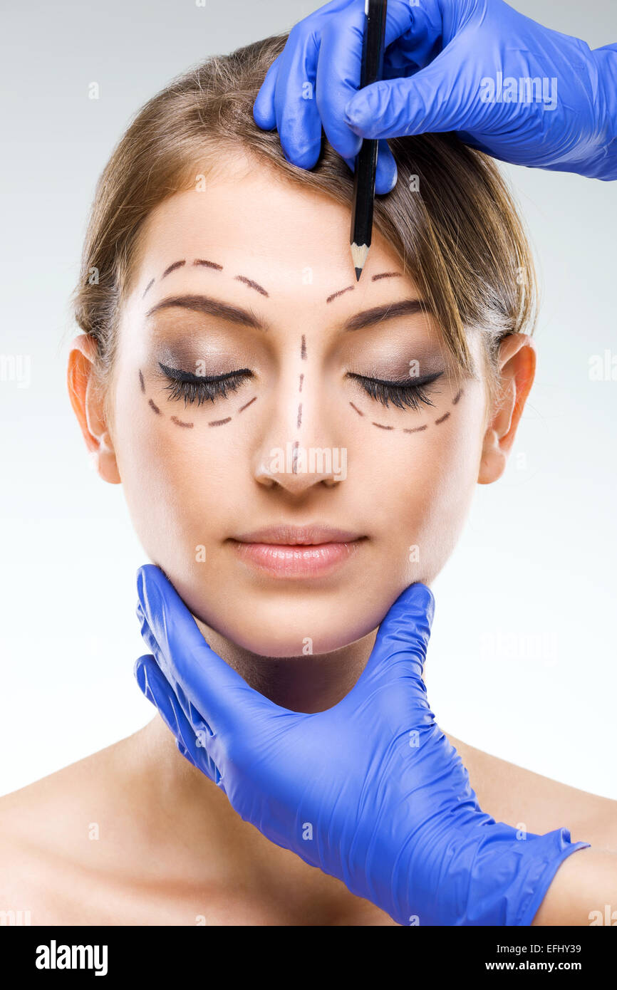 Plastic surgery - Beautiful woman face, with surgical markings Stock ...