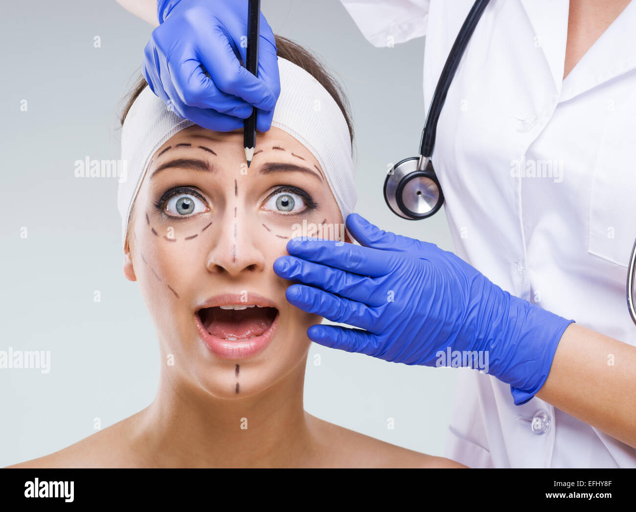 Beautiful woman face, with surgical markings when startled look Stock ...