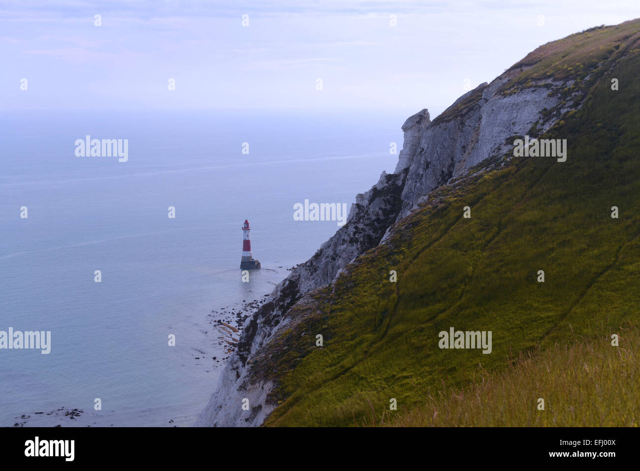 Beachy Head lighthouse, sea and cliffs edge Stock Photo - Alamy