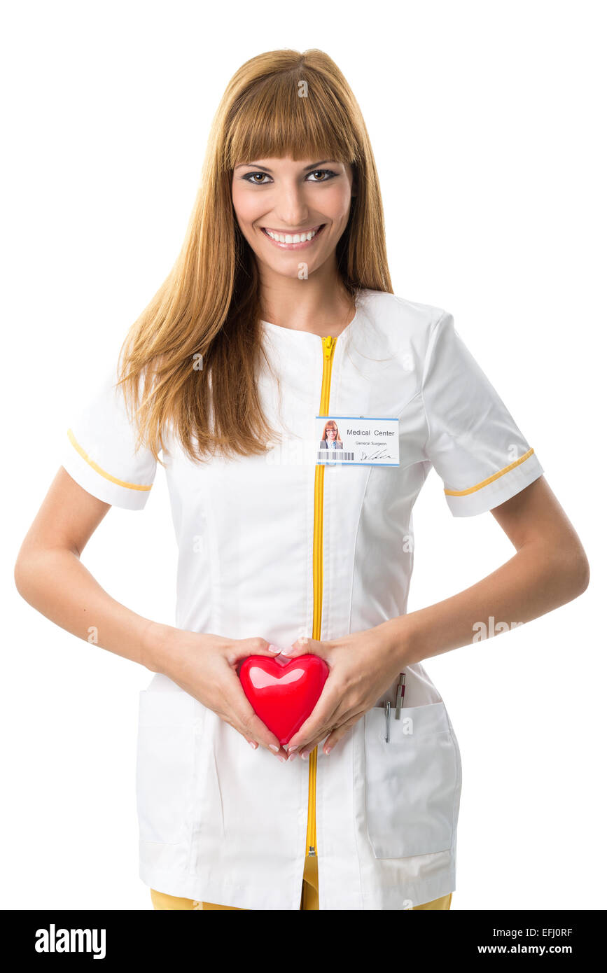 Beautiful nurse ,holding red heart Stock Photo - Alamy