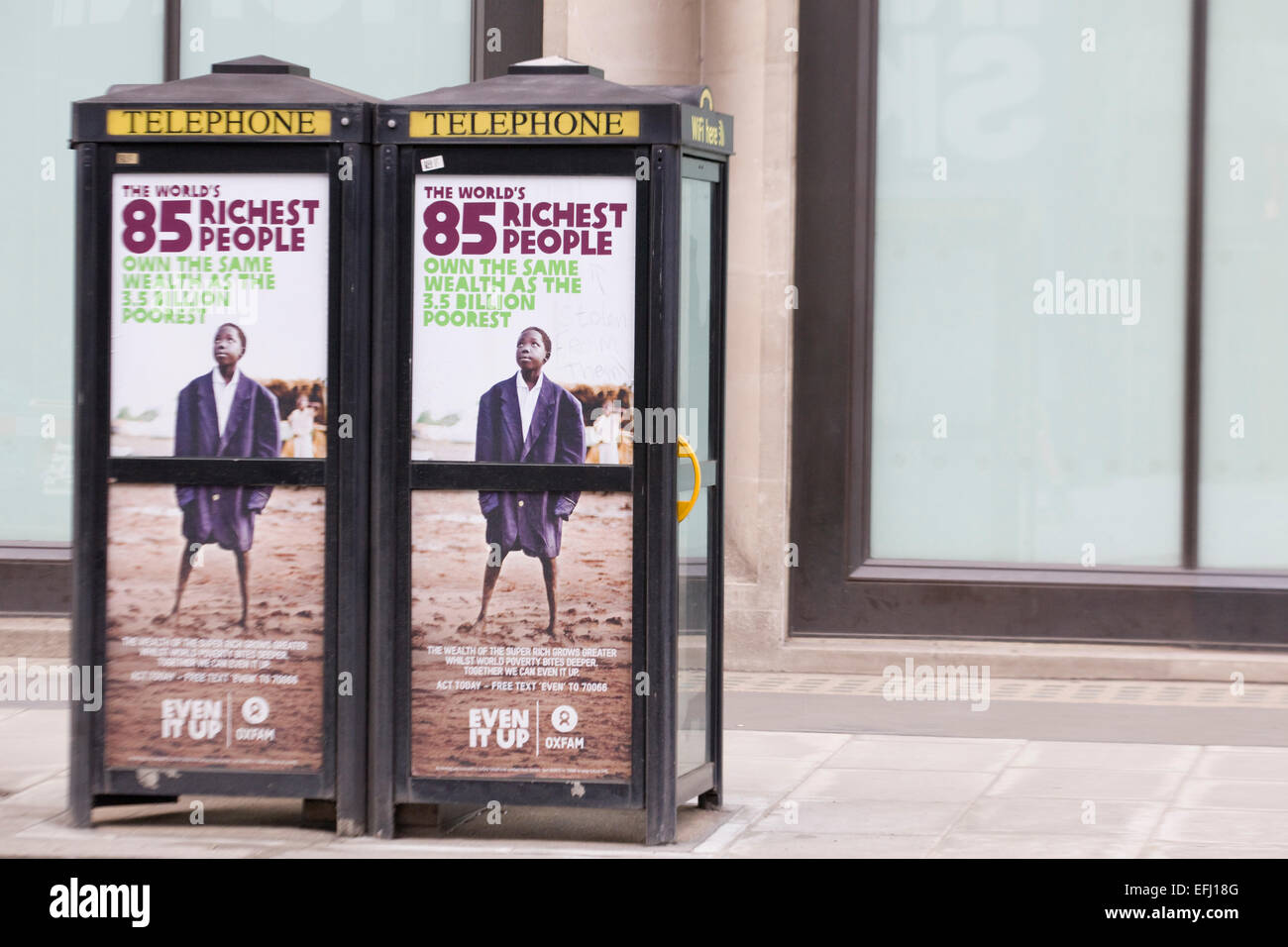 Advertising on the back of a Telephone box Stock Photo - Alamy