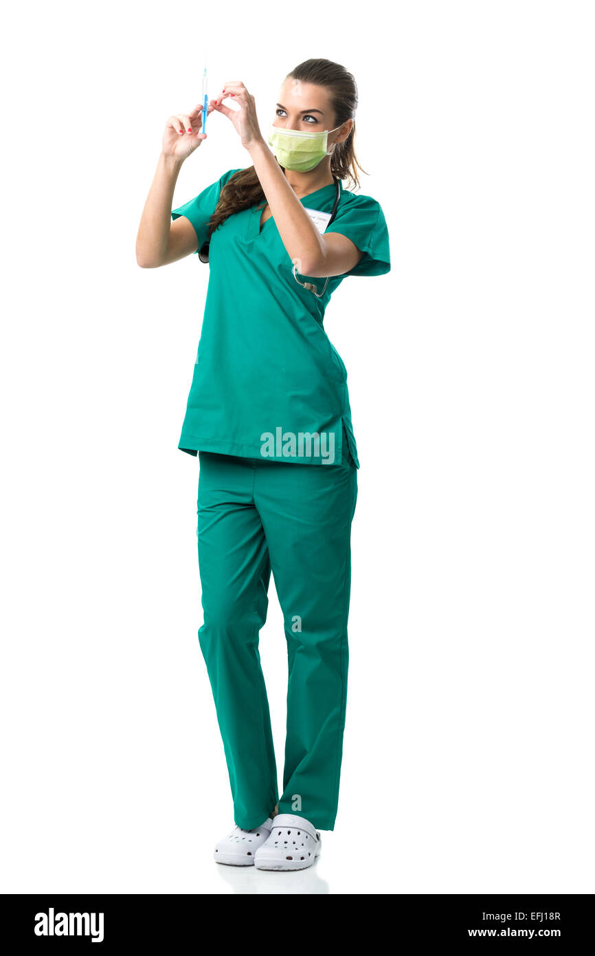Pretty surgeon in green mouth mask,holding the injection Stock Photo ...