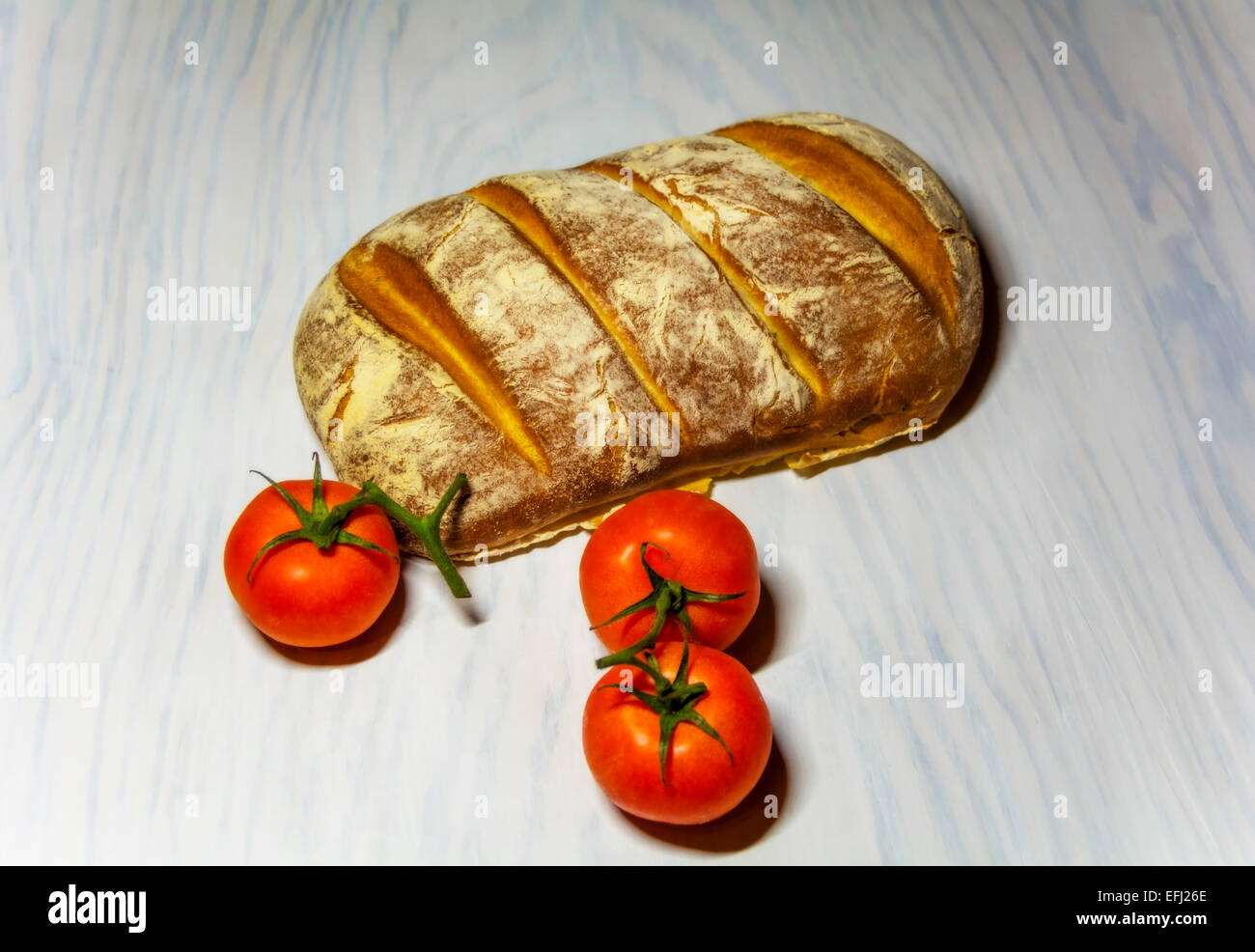 A simple home made bloomer loaf with tomatoes Stock Photo - Alamy