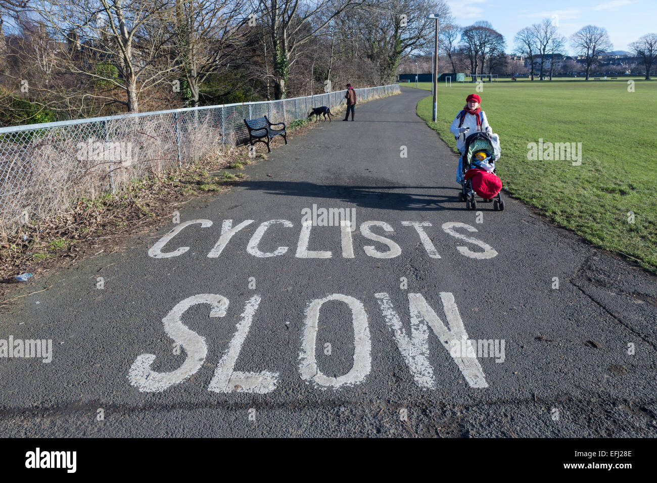 Signage advising cyclists to ride slowly on a shared cycle and footpath ...