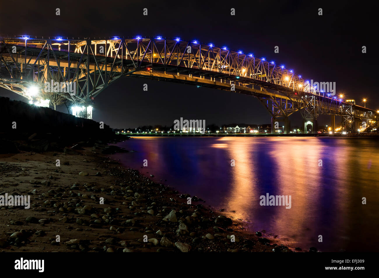 Lighted bridge at night Stock Photo - Alamy