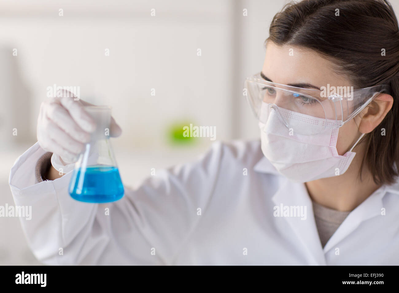 close up of scientist with flask making test Stock Photo - Alamy