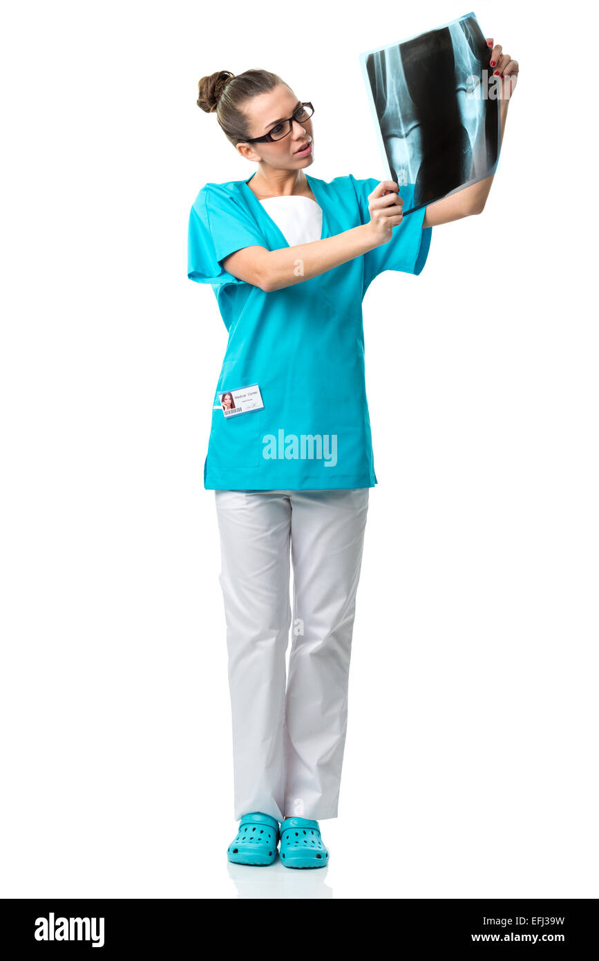 Beautiful radiologist looking at x-ray image Stock Photo - Alamy