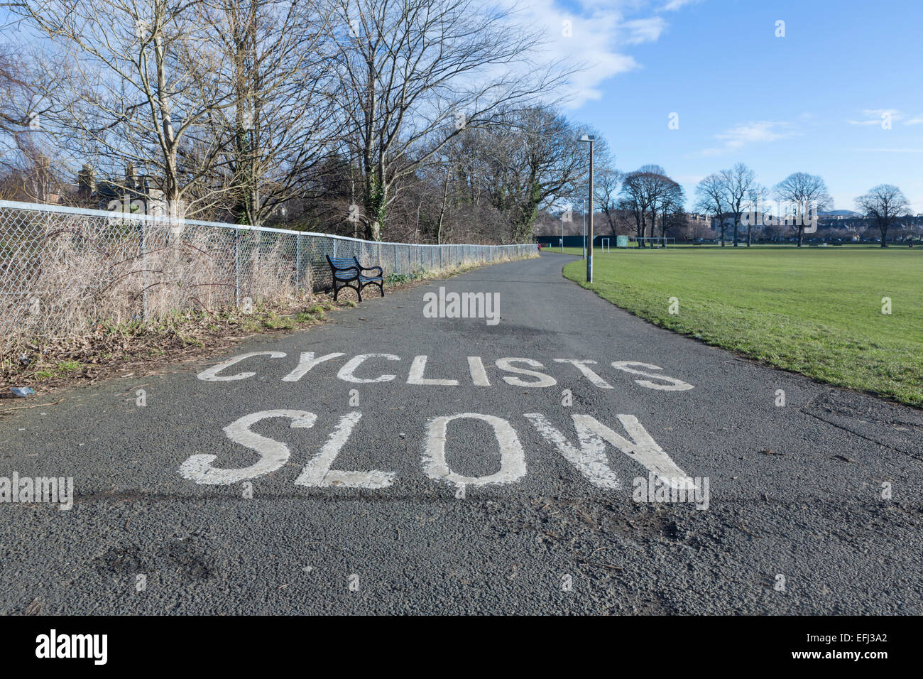 Signage advising cyclists to ride slowly on a shared cycle and footpath ...