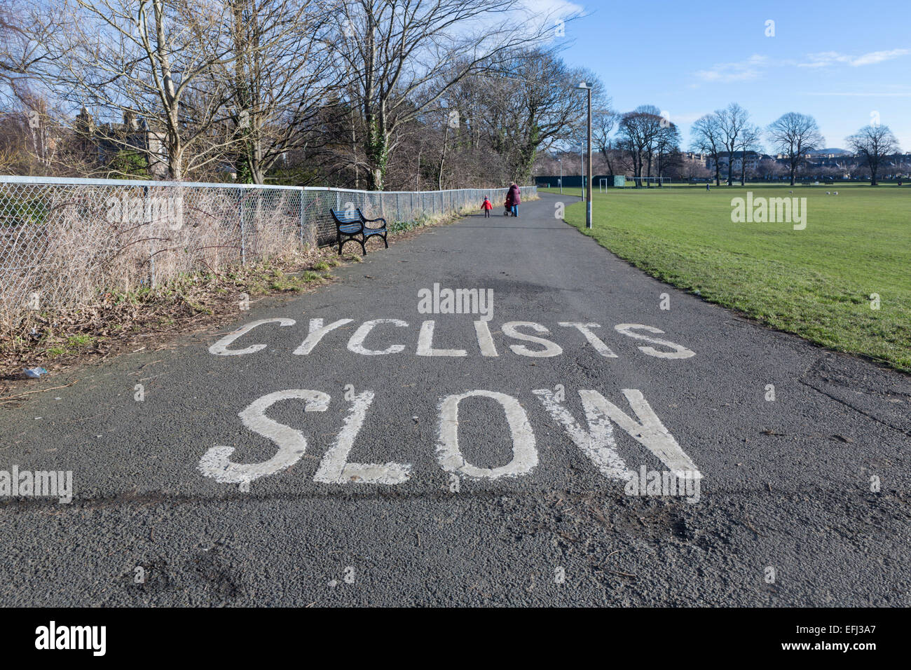 Signage advising cyclists to ride slowly on a shared cycle and footpath ...