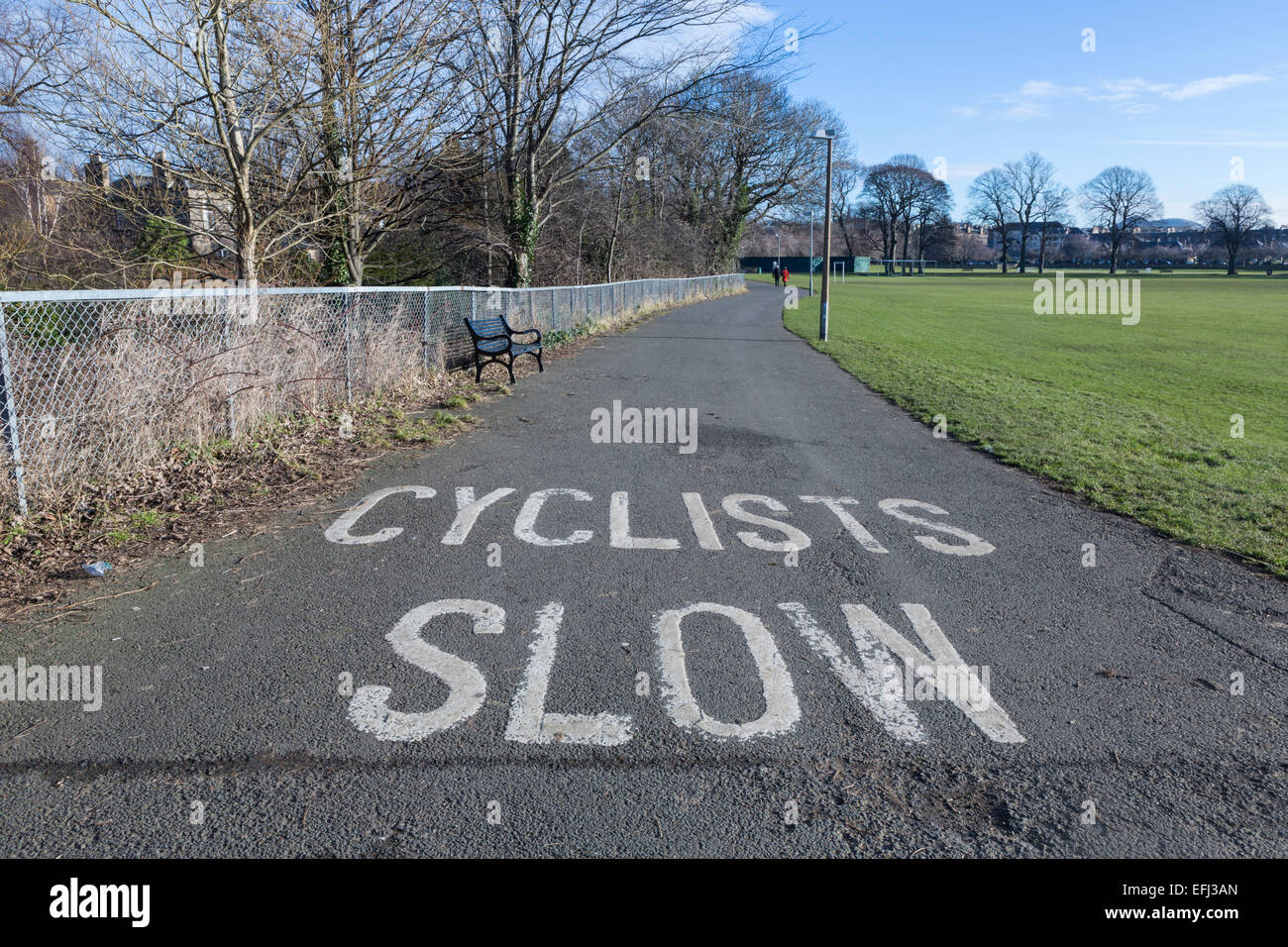 Signage advising cyclists to ride slowly on a shared cycle and footpath ...