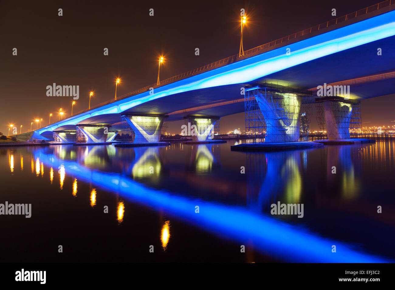 Blue illuminated Al Garhoud Bridge in Dubai, United Arab Emirates Stock ...