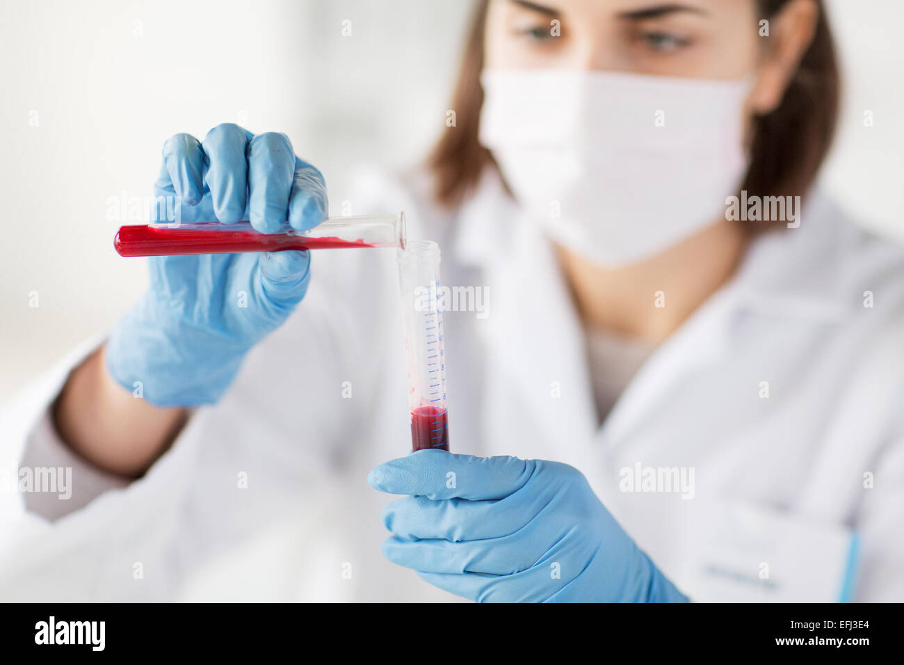 Test tubes blood in beaker hi-res stock photography and images - Alamy