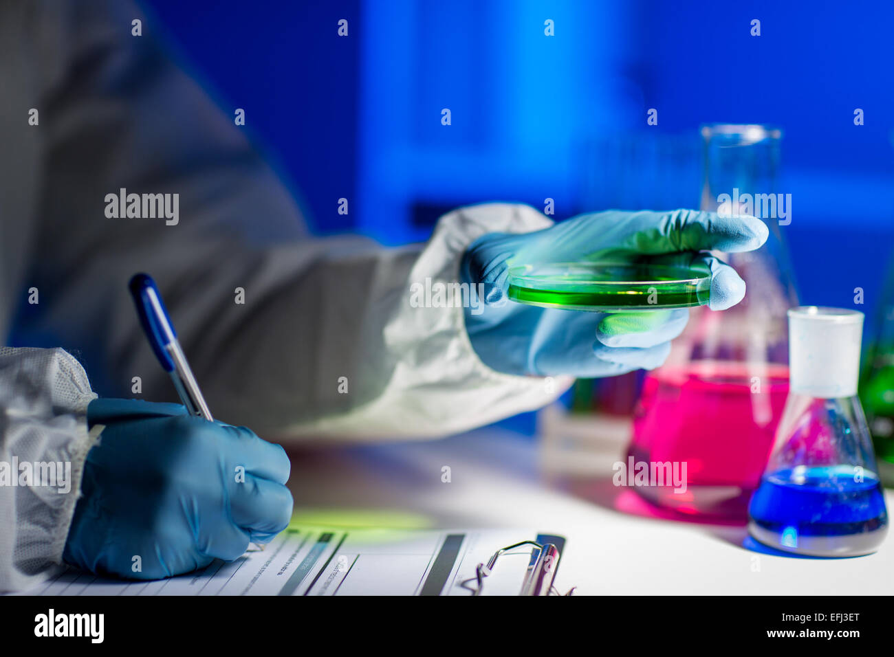 close up of scientist writing test results in lab Stock Photo - Alamy